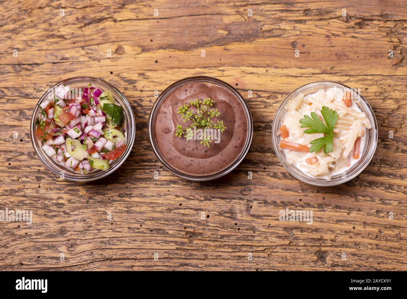 three mexican salsas on dark wood Stock Photo - Alamy