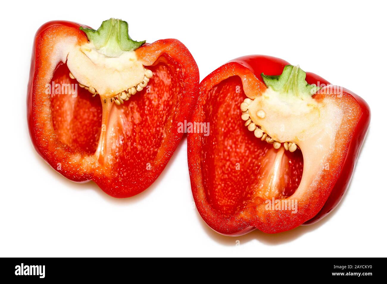 a red paprika split in the middle Stock Photo - Alamy