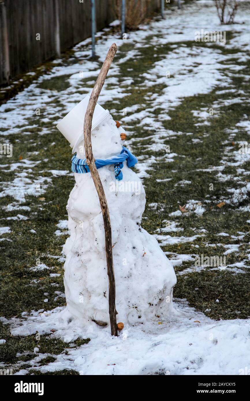 a snowman defies the dying winter Stock Photo - Alamy