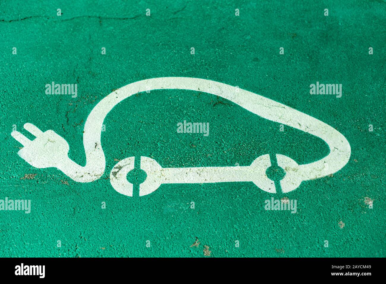 Car charging symbol painted on asphalt Stock Photo - Alamy