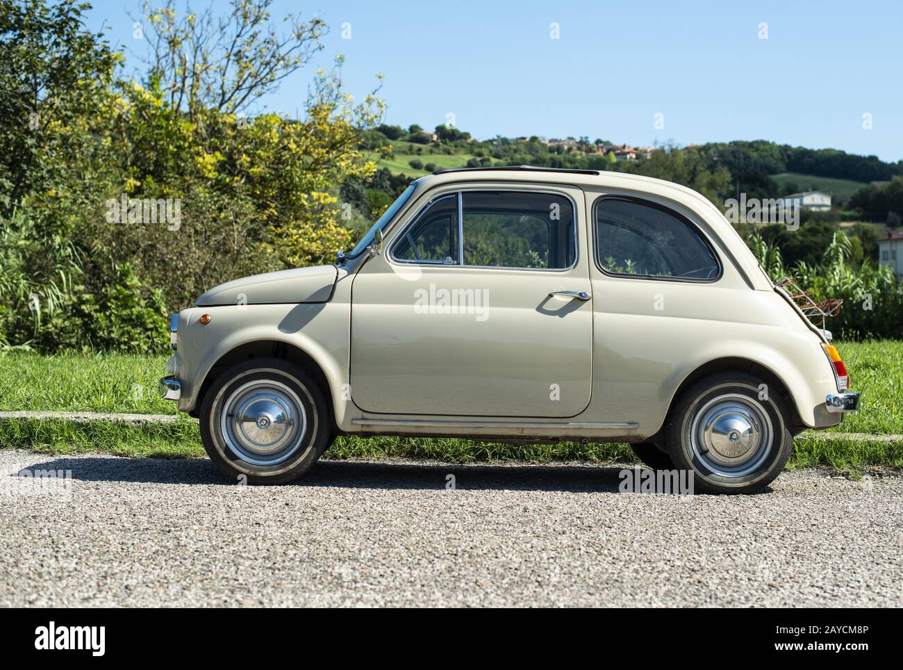 Vintage beige color car. Small old car. Italian car Stock Photo - Alamy