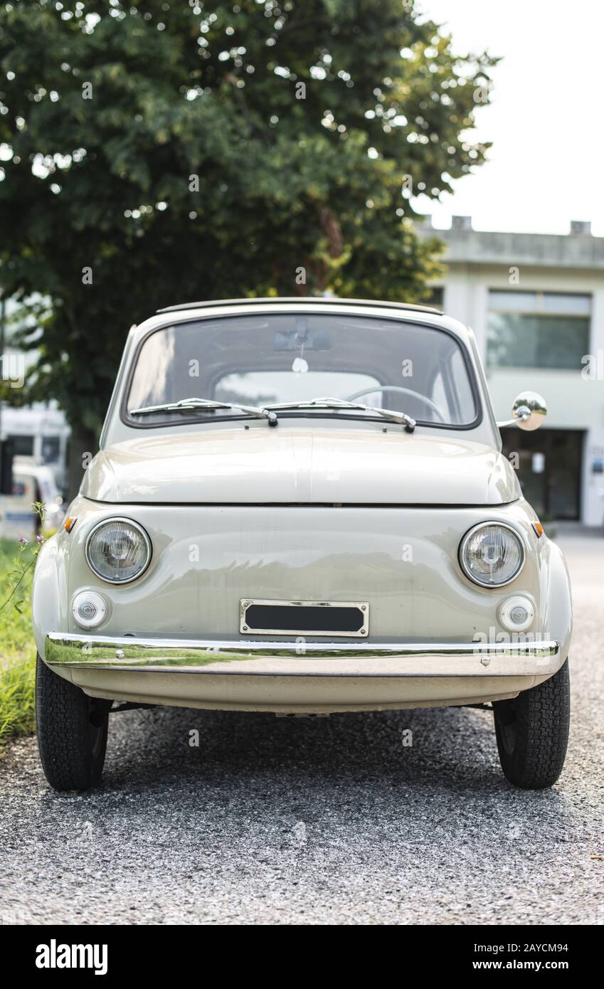 Vintage beige color car. Small old car. Italian car Stock Photo - Alamy