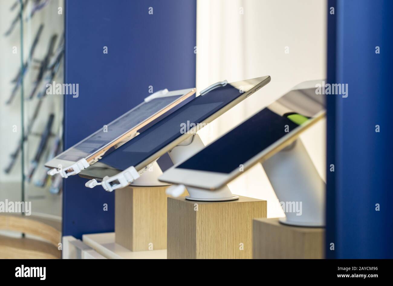 Cell Phones on shelf in telecommunication shop. Lights over GSM phones ...