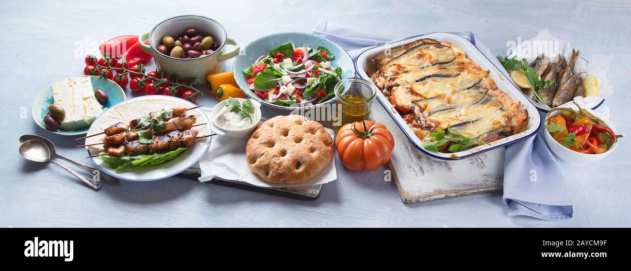 Greek food. Moussaka, meze, souvlaki, fish, pita, greek salad, tzatziki ...