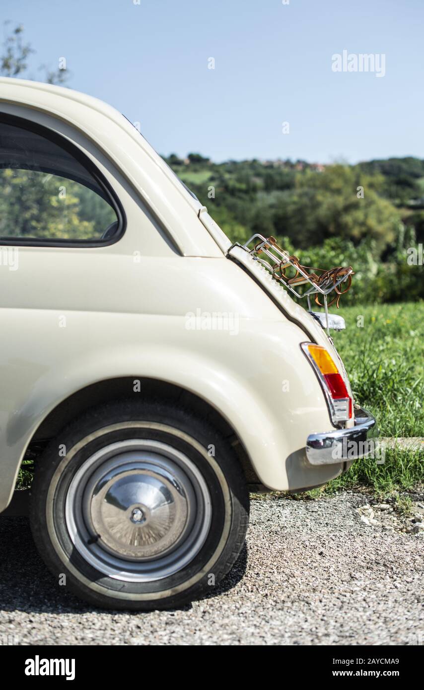Vintage beige color car. Small old car. Italian car Stock Photo - Alamy