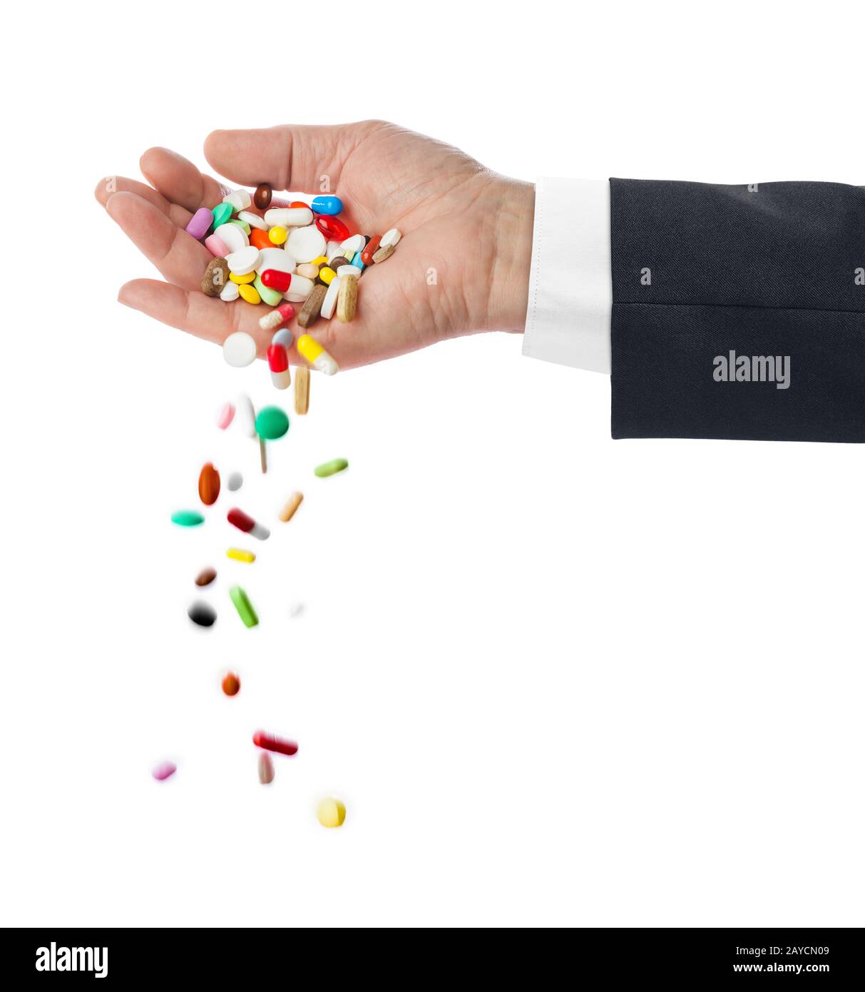 Hand and falling pills Stock Photo - Alamy