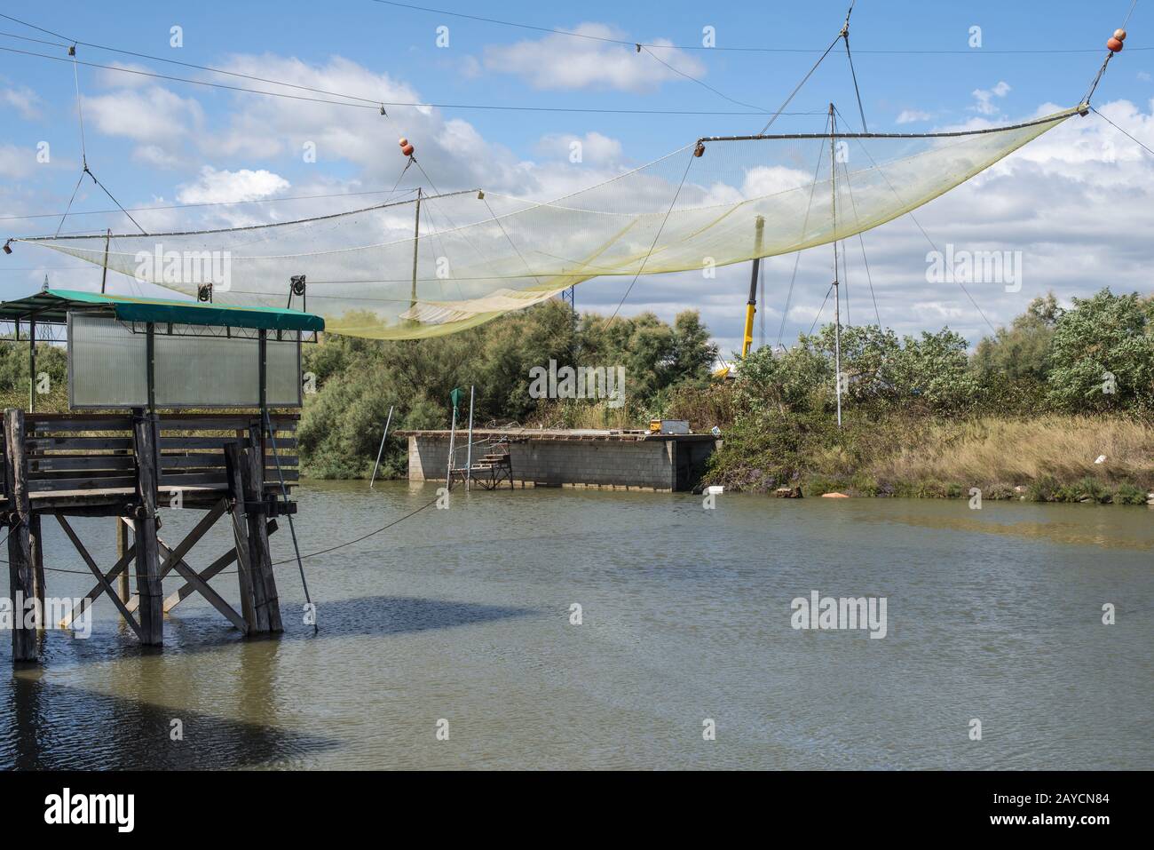 Fishing houses in dock and fishnet Stock Photo - Alamy