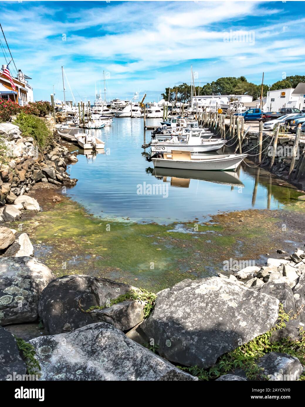 Small boats lining waterfront in Wickford Cove Stock Photo - Alamy