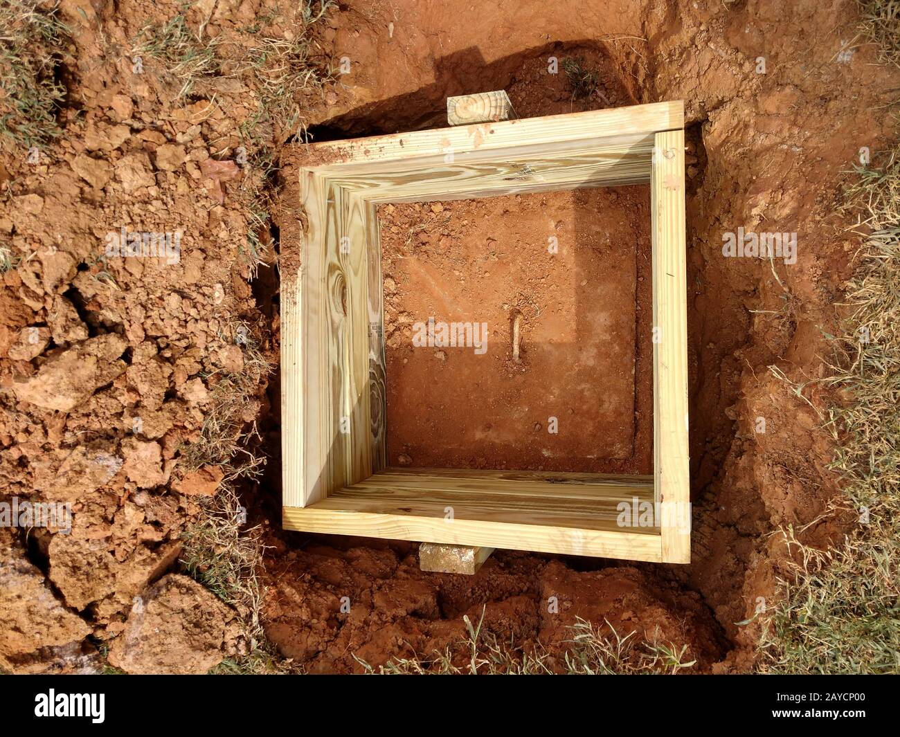 hole in the ground for house septic tank Stock Photo - Alamy
