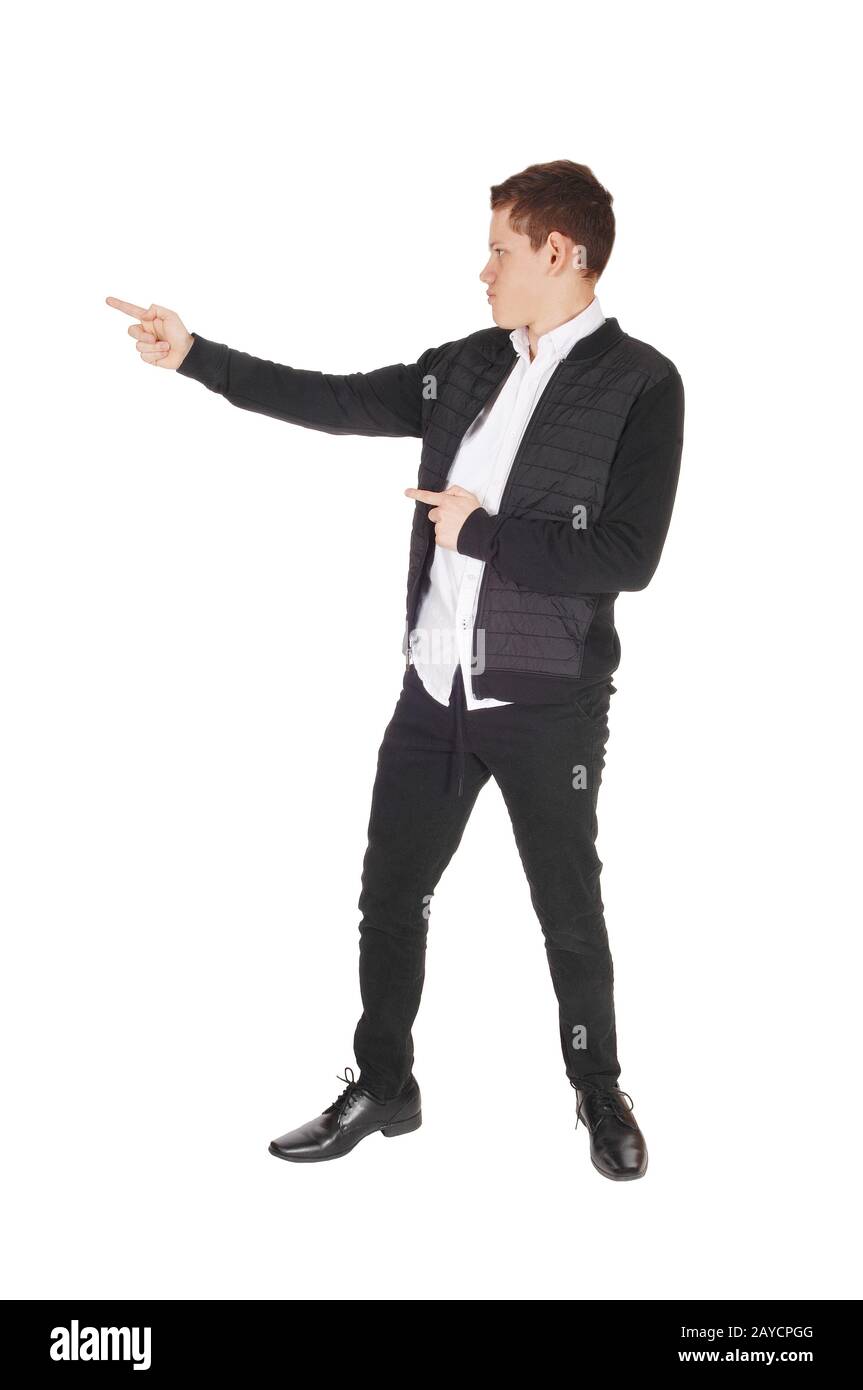 Teen boy standing in full length, pointing with his fingers Stock Photo ...