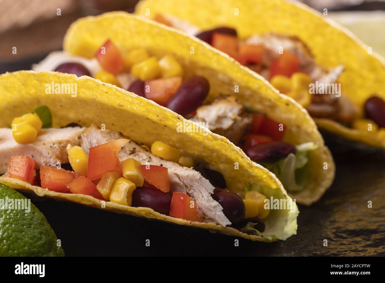 three Mexican tacos on slate Stock Photo - Alamy
