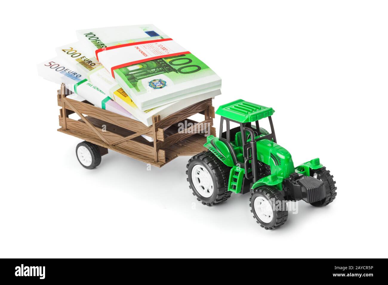 Toy tractor with money Stock Photo - Alamy