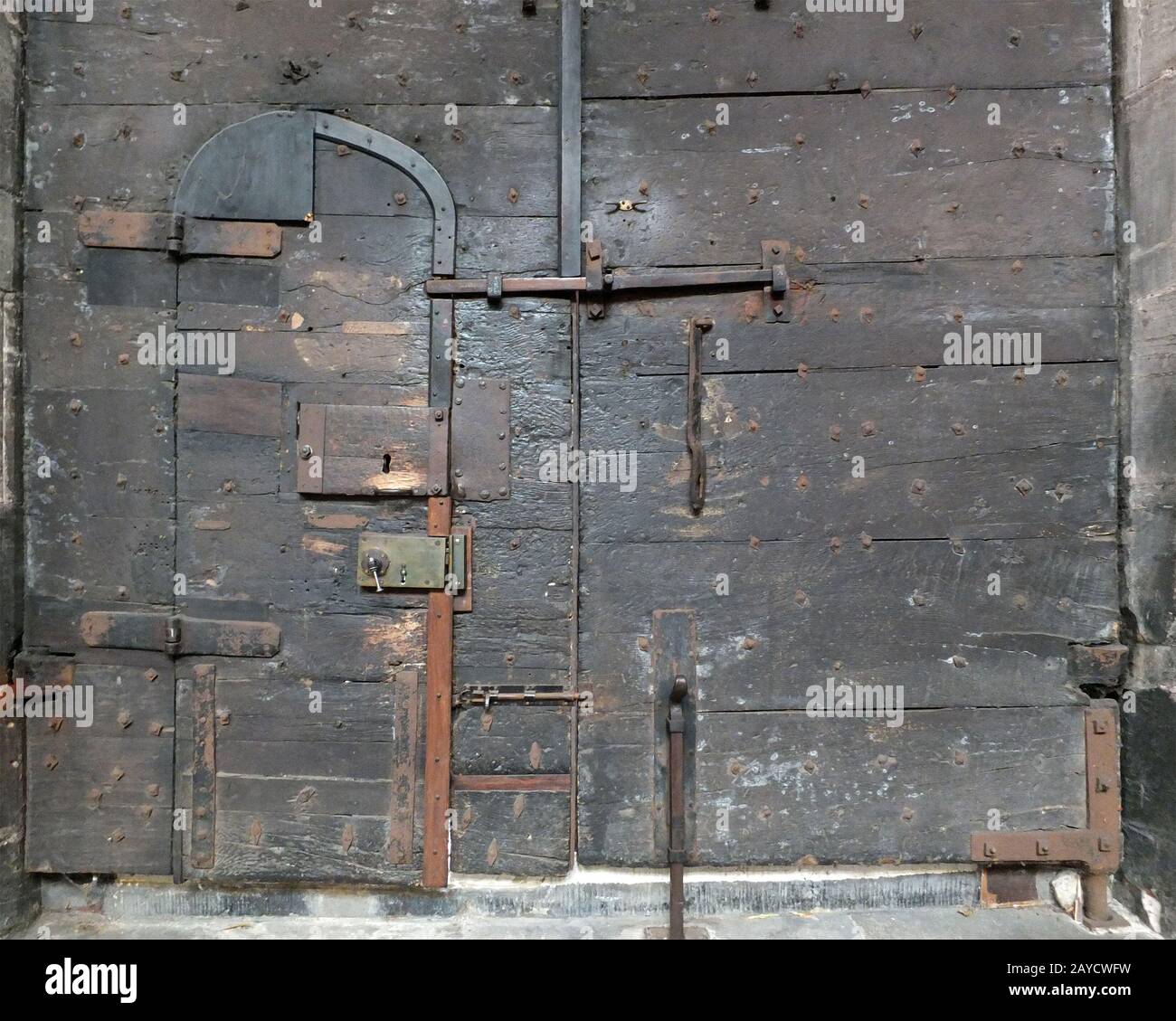 door ancient black wooden medieval door with iron locks and bolts on ...