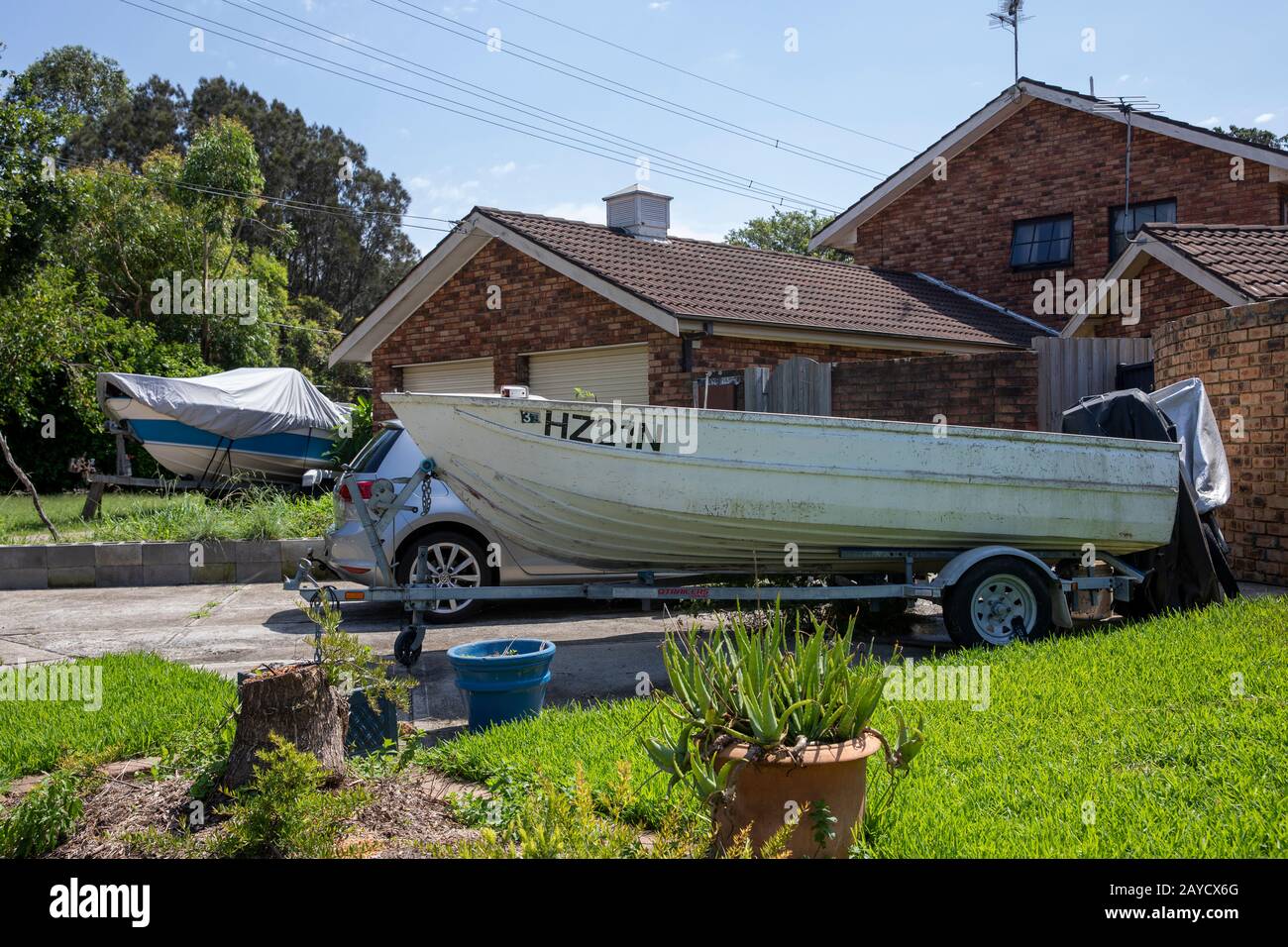 Typical australian home in Mona Vale with garden and trailer boat at ...