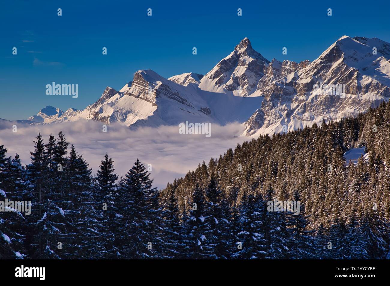 Inversion in valley and illuminated mountain peaks Stock Photo - Alamy