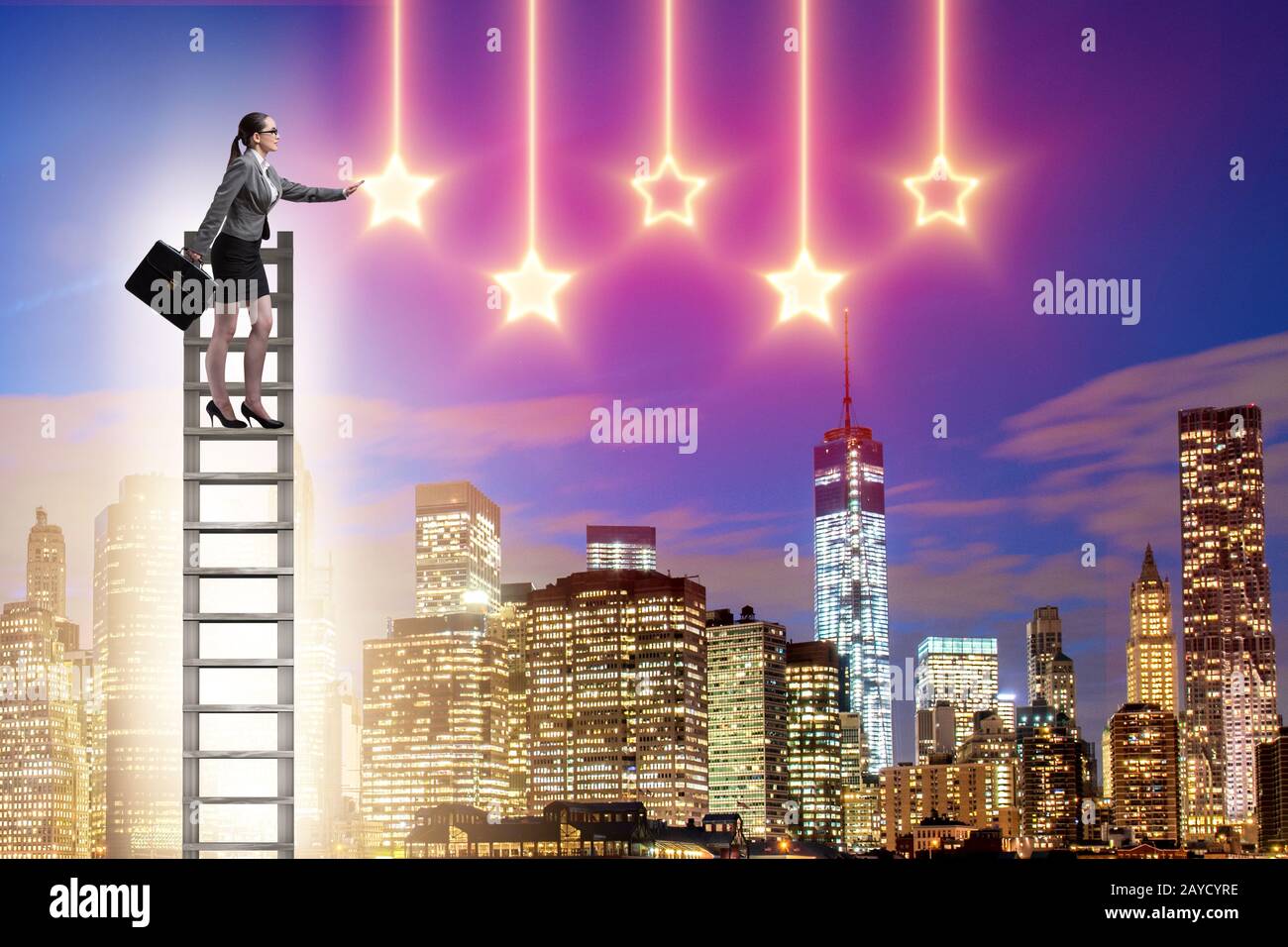 Businesswoman reaching out for stars in success concept Stock Photo - Alamy