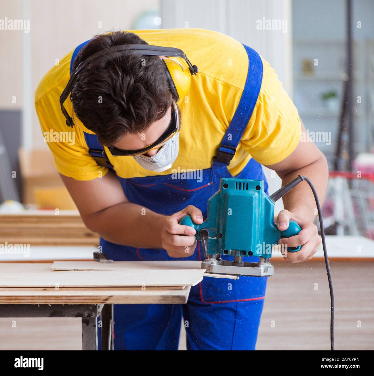 Carpenter working in the workshop Stock Photo - Alamy