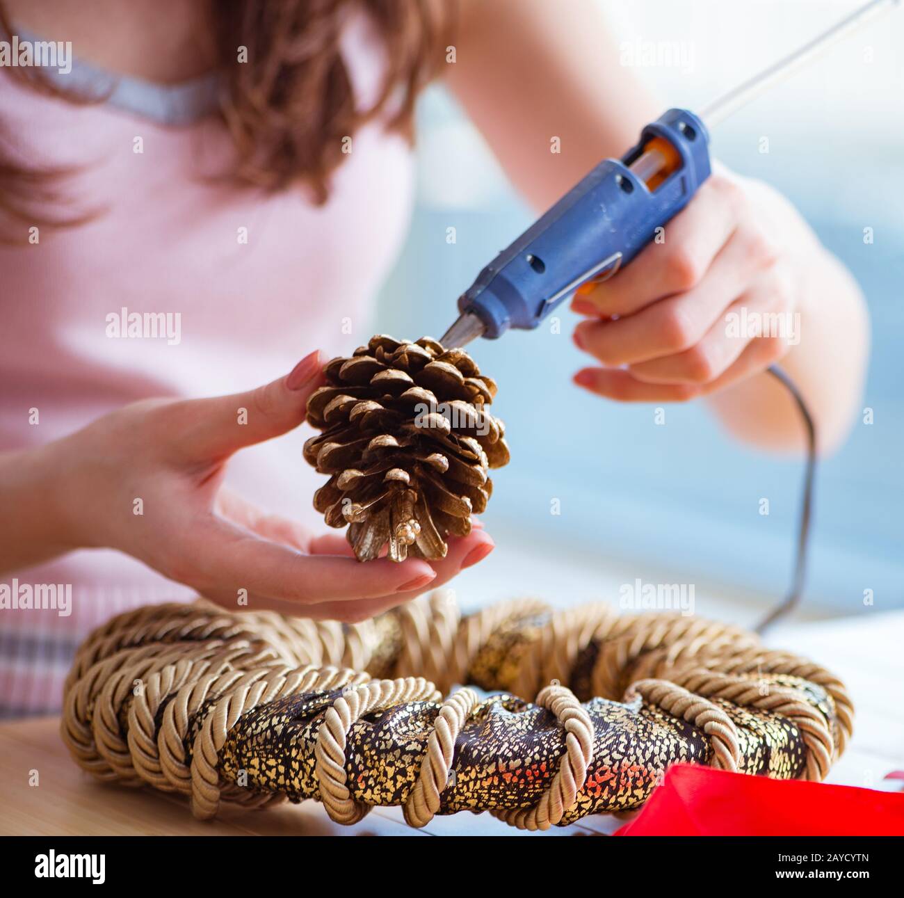 Woman doiing DIY festive decorations at home Stock Photo - Alamy