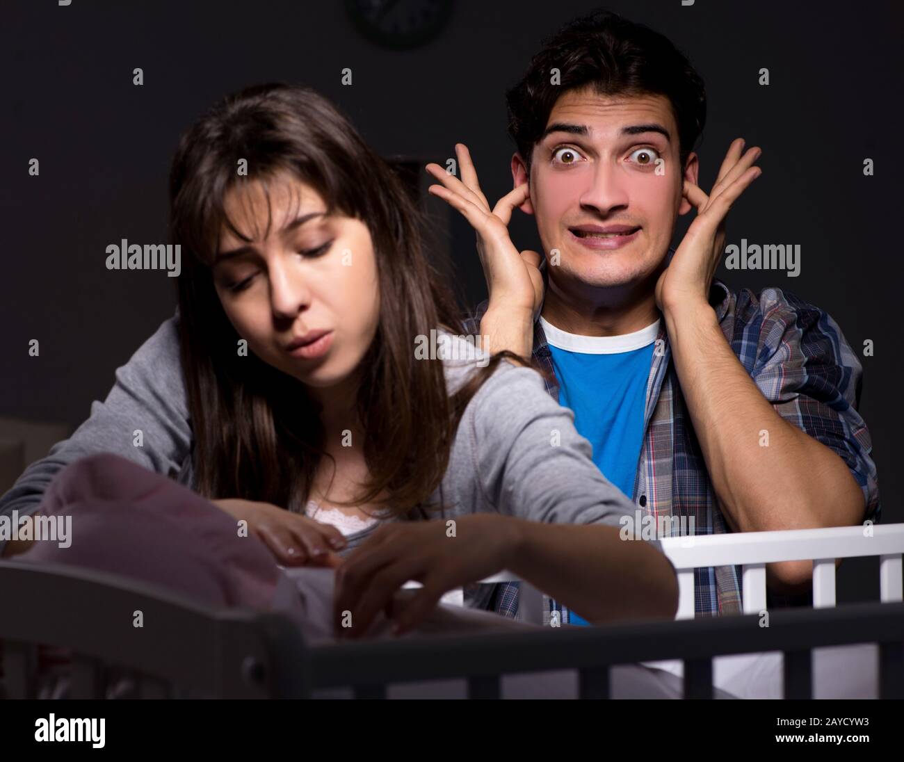 The young parents sleepless with newborn baby at night Stock Photo - Alamy