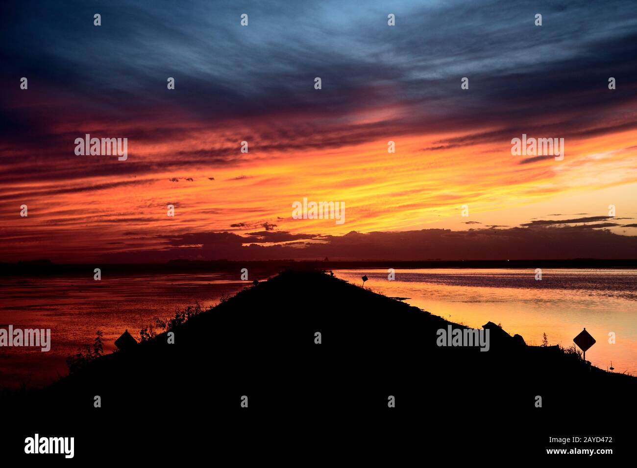 Prairie Sunset lake and road Stock Photo - Alamy