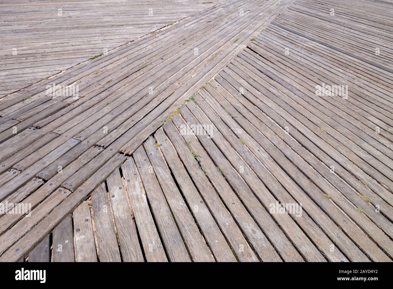 weathered old crossing boardwalk planks in an angle perspective Stock ...