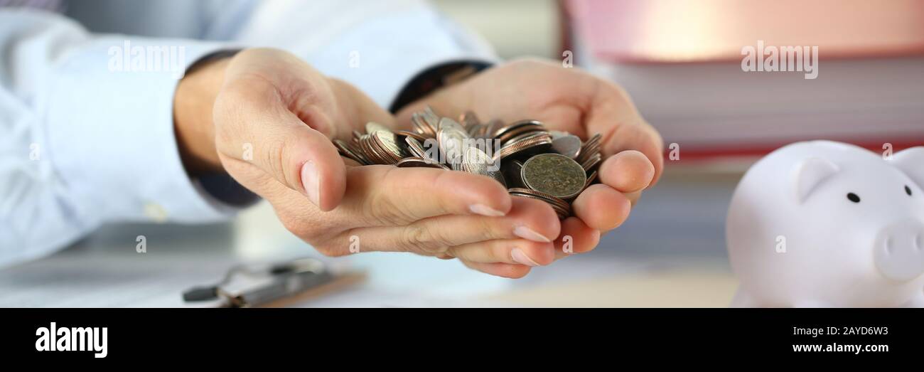 Hand businessman putting pin money Stock Photo - Alamy