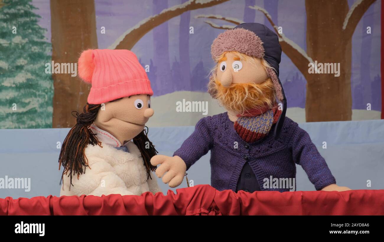 Puppets talking and looking at the camera. Puppet girl and puppet boy ...