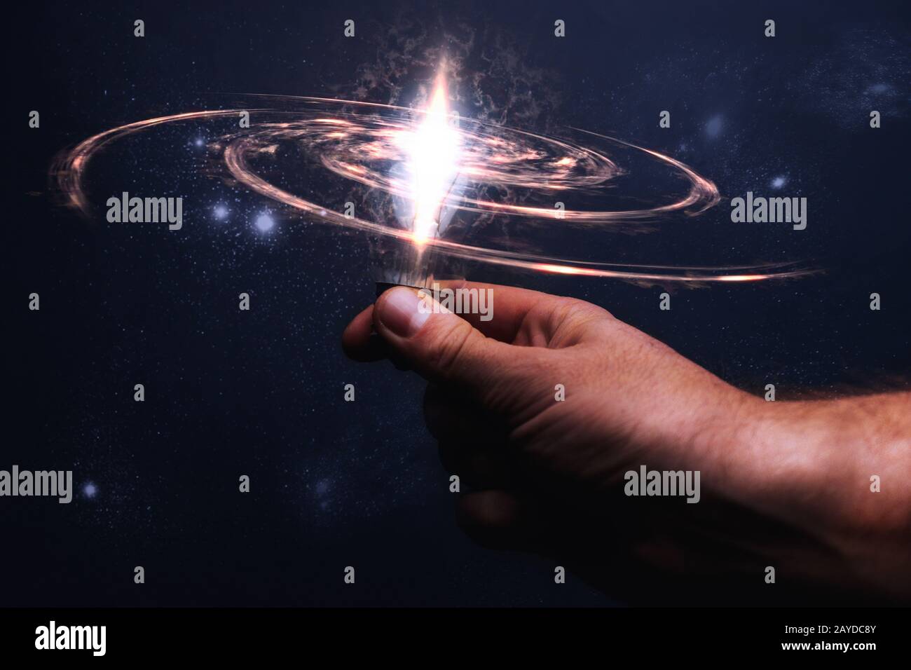 Human hand holding light bulb with nebula dust inside and sunshine ...