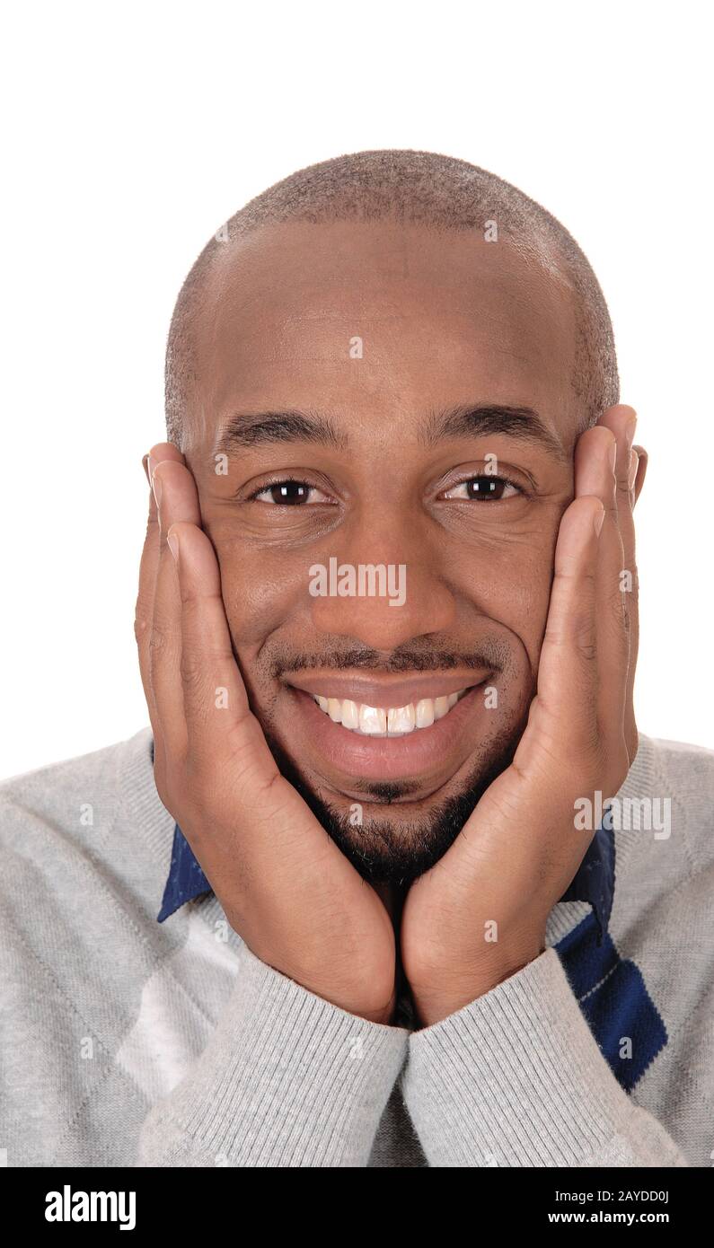Happy African man with hands on his face Stock Photo - Alamy