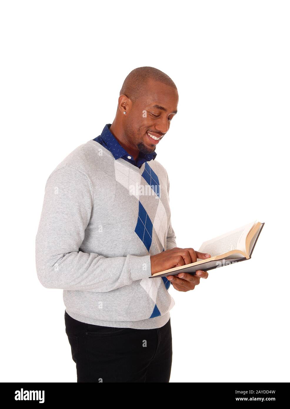 African man standing, reading a book Stock Photo - Alamy