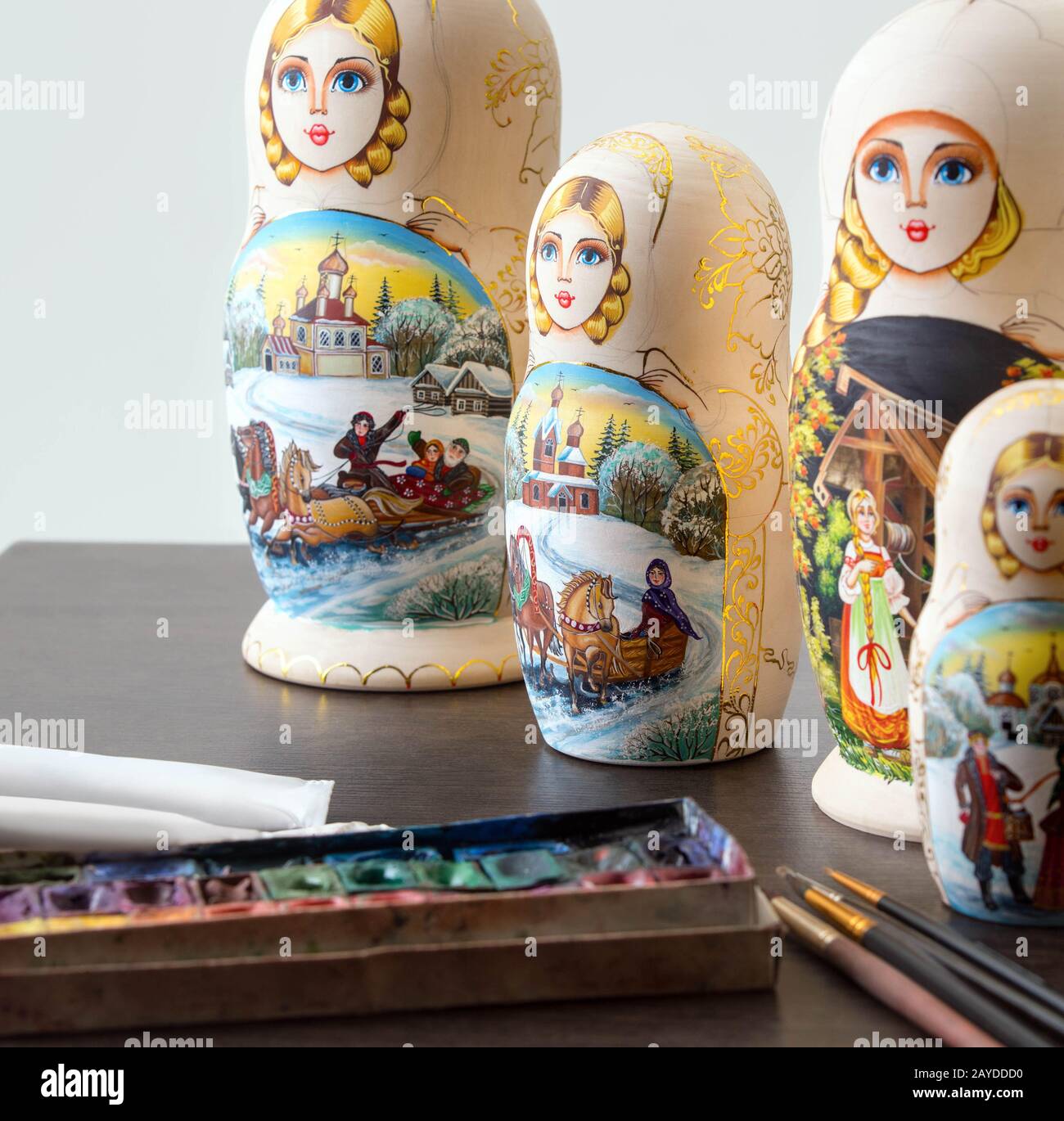 Wooden nested dolls on the table at workshop Stock Photo - Alamy