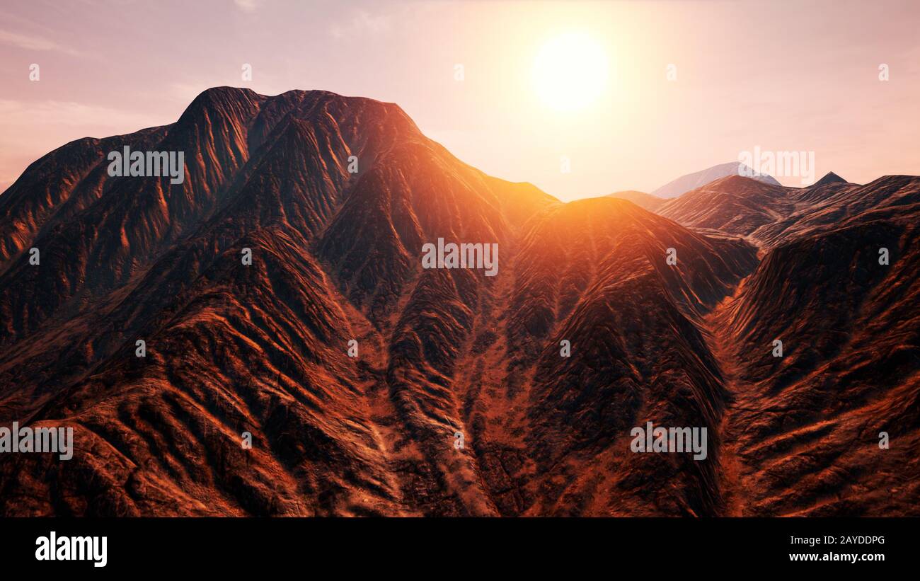 Sun Rays over Mountains in a Valley Stock Photo - Alamy