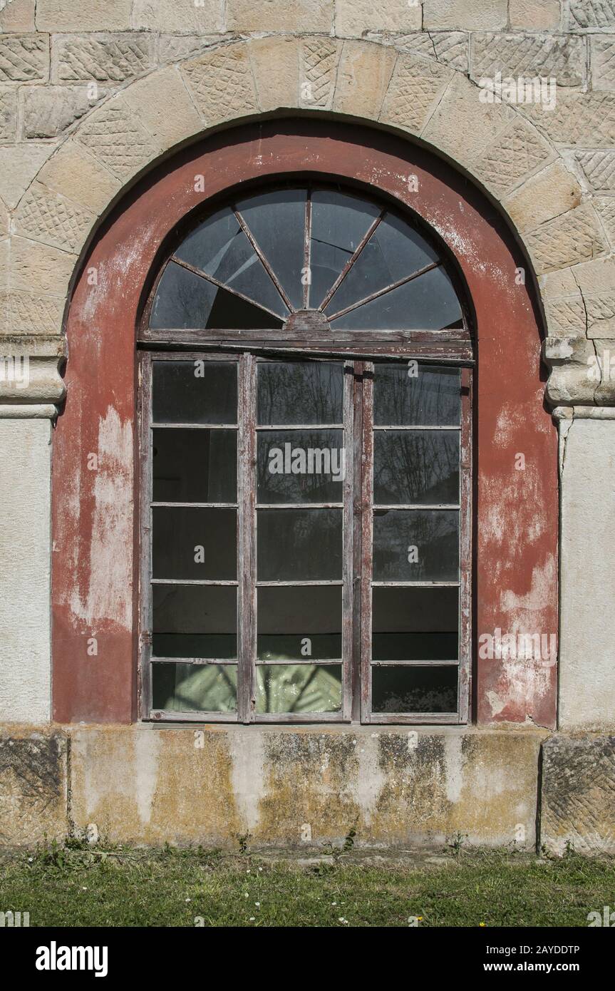 Old weathered glass church window with wooden frame closeup Stock Photo ...