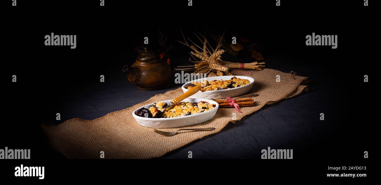 Cinnamon prunes with crumble Stock Photo - Alamy