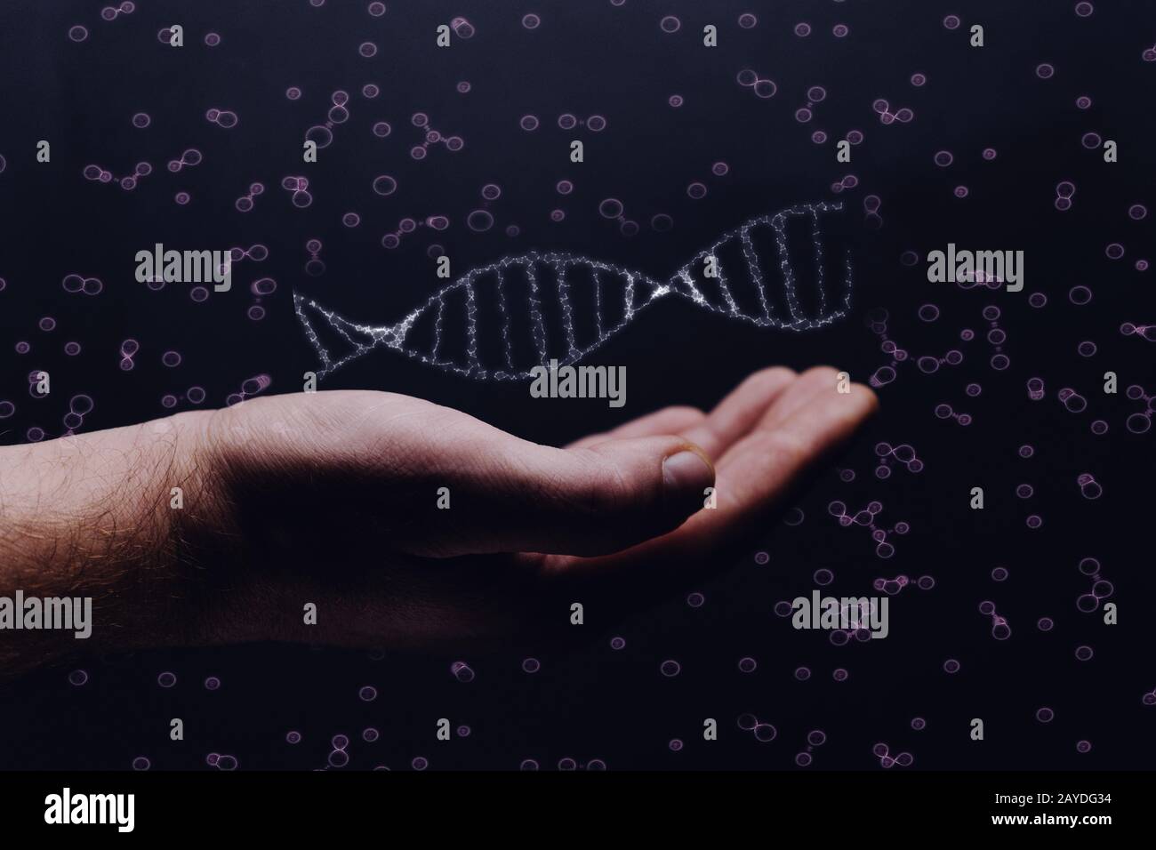 Man holding DNA molecule in palm Stock Photo - Alamy