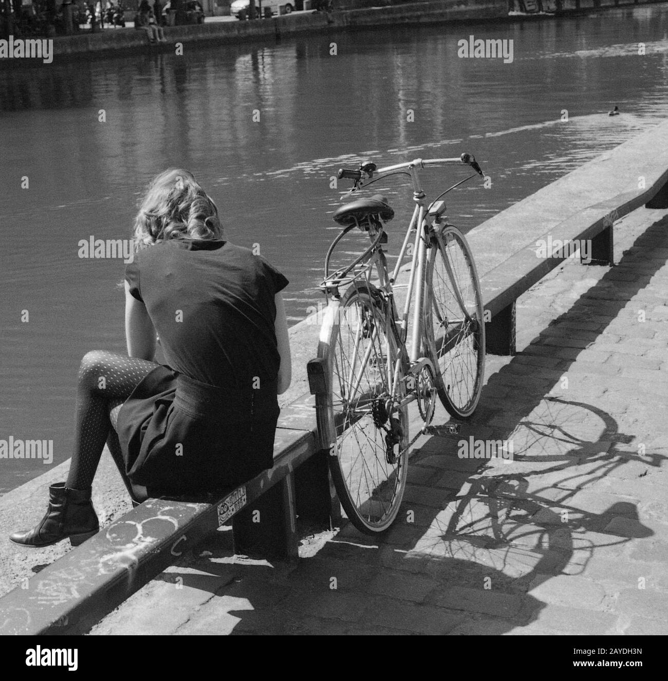 Young woman seen behind Black and White Stock Photos & Images - Alamy
