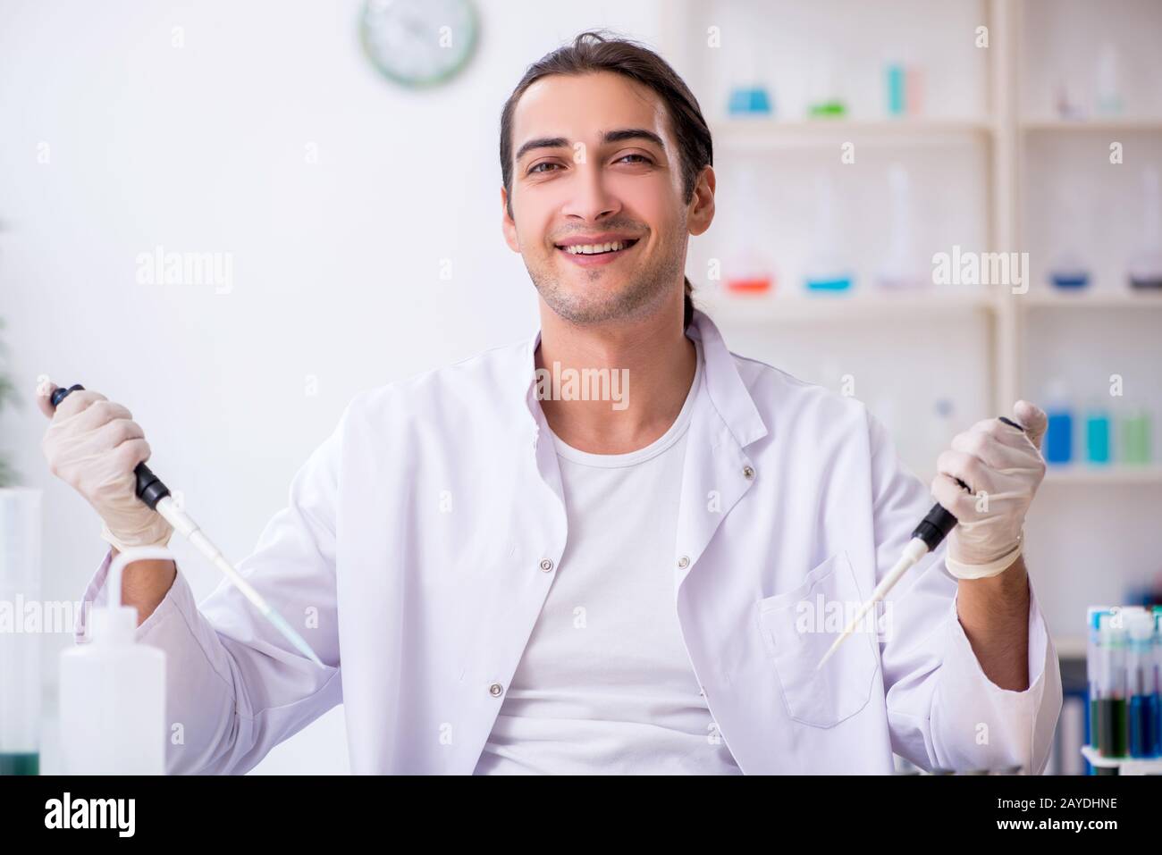 Chemist examining test tubes taking hi-res stock photography and images ...