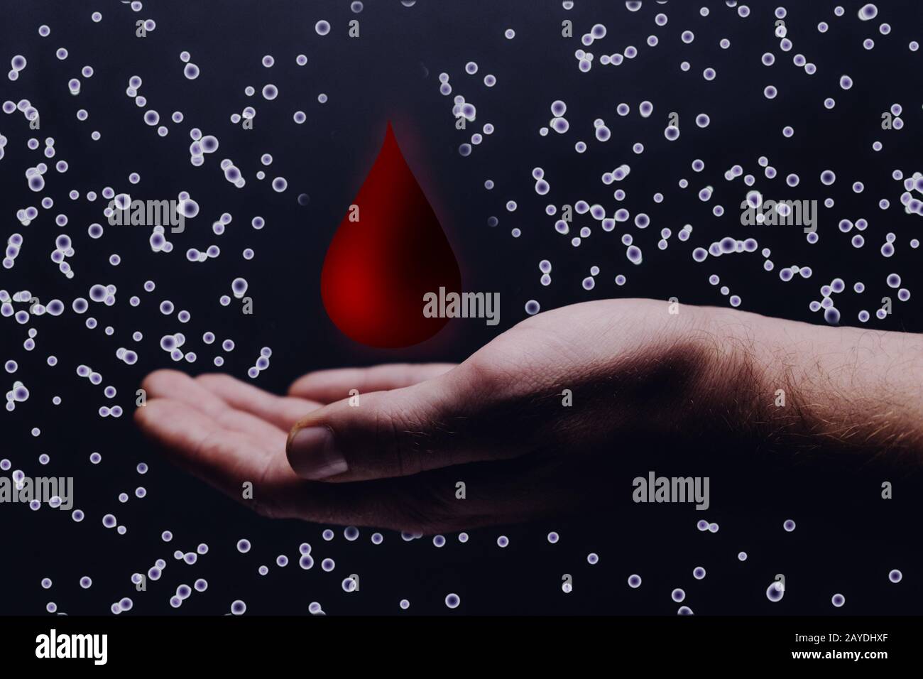 Human hand blood drop. Nebula dust in infinite space. World Blood Donor ...