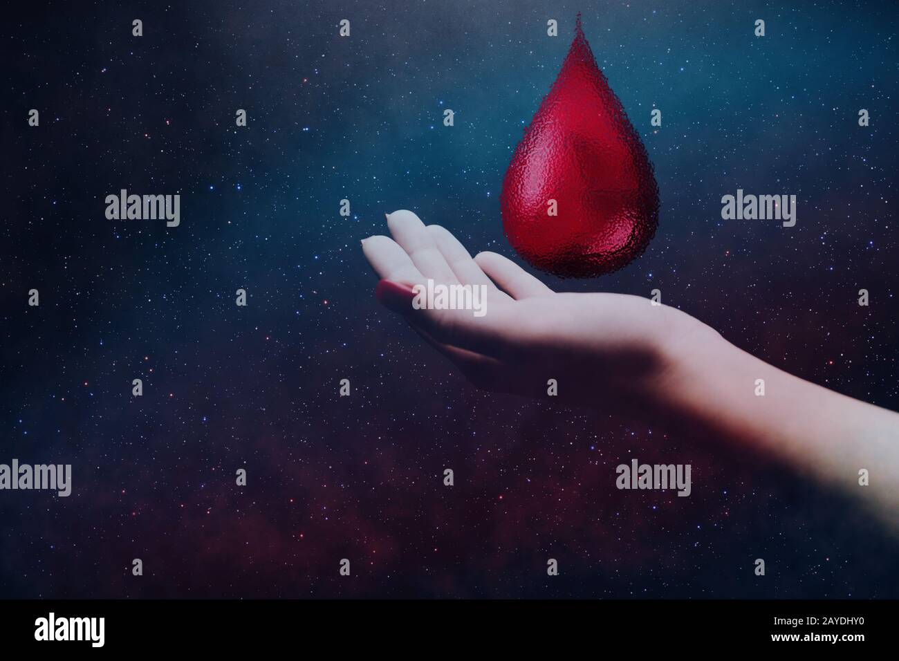 Human hand blood drop. Nebula dust in infinite space. World Blood Donor ...