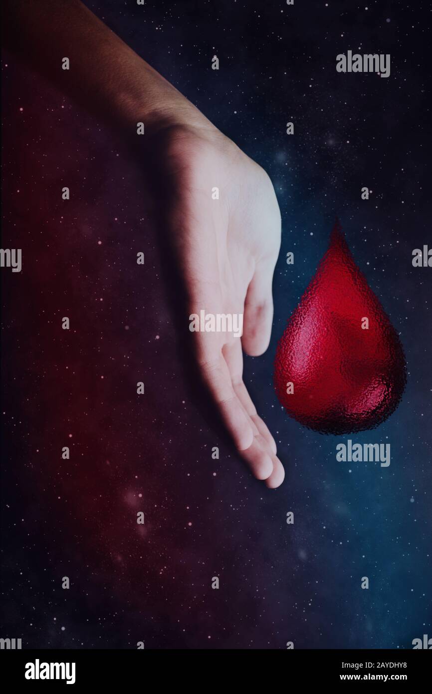 Human hand blood drop. Nebula dust in infinite space. World Blood Donor ...