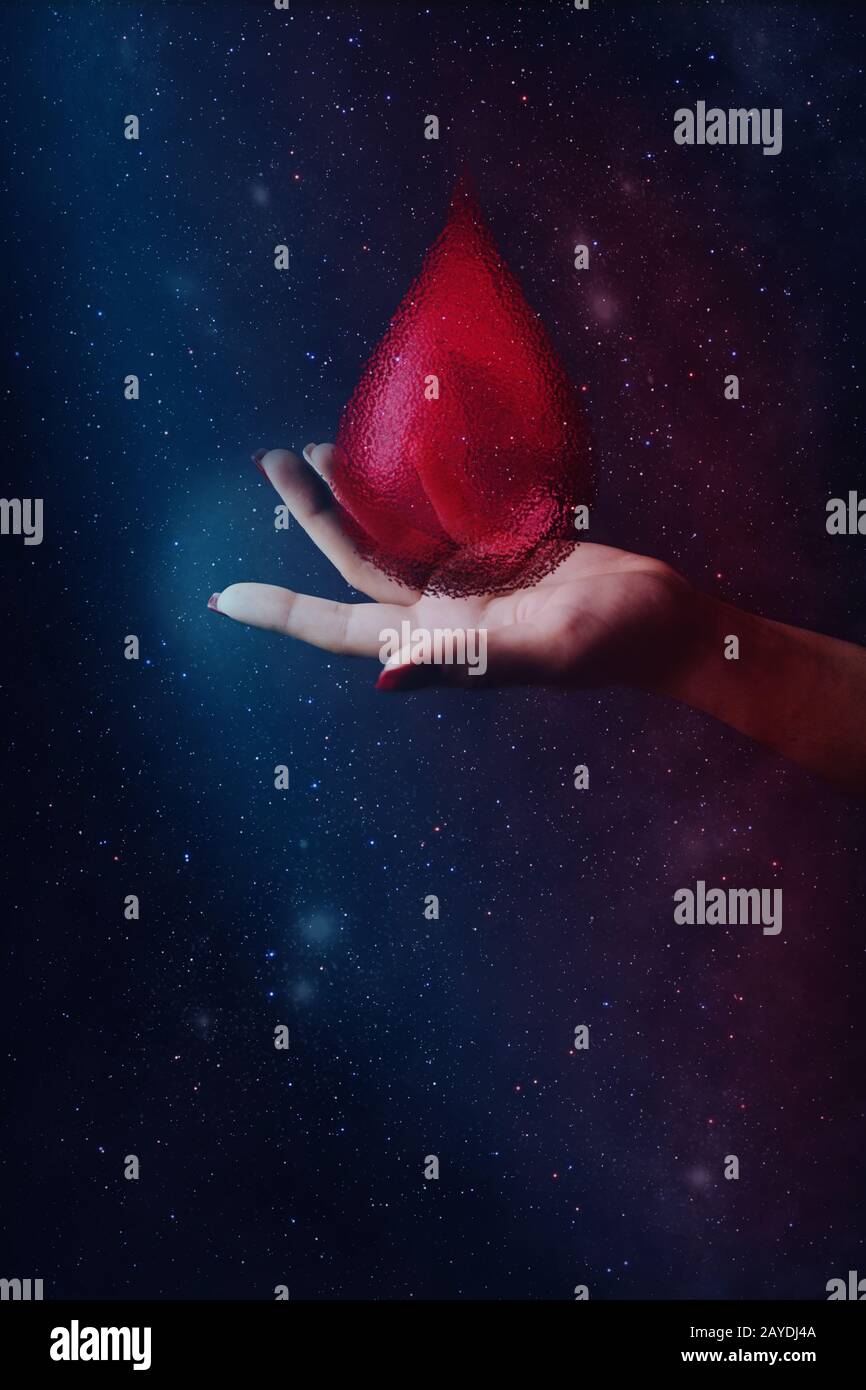 Human hand blood drop. Nebula dust in infinite space. World Blood Donor ...