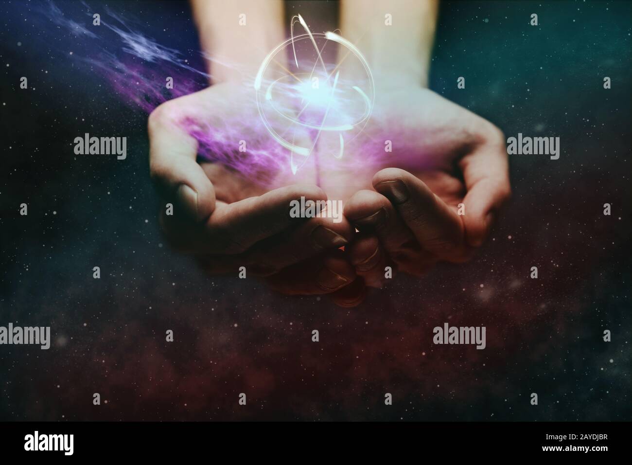 Human hand holding atom on a palm. Nebula dust in infinite space. Mixed ...