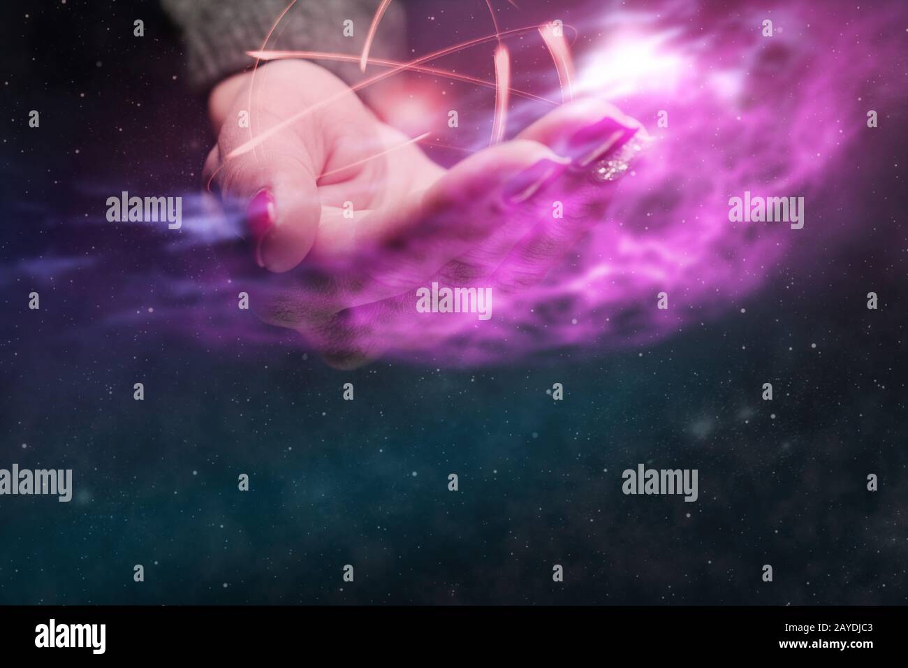 Human hand holding atom on a palm. Nebula dust in infinite space. Mixed ...