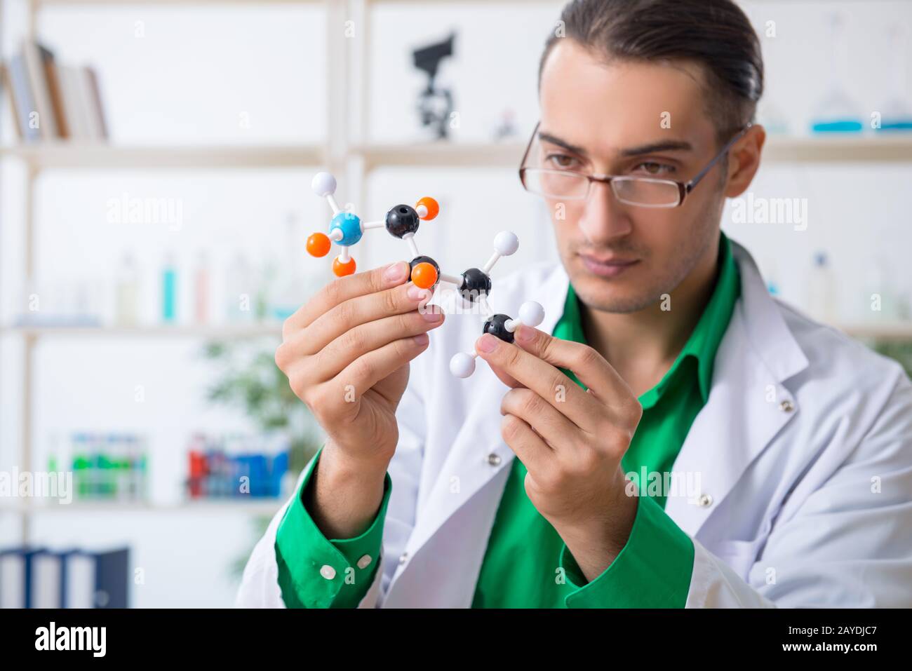 Young male chemist teacher hi-res stock photography and images - Alamy