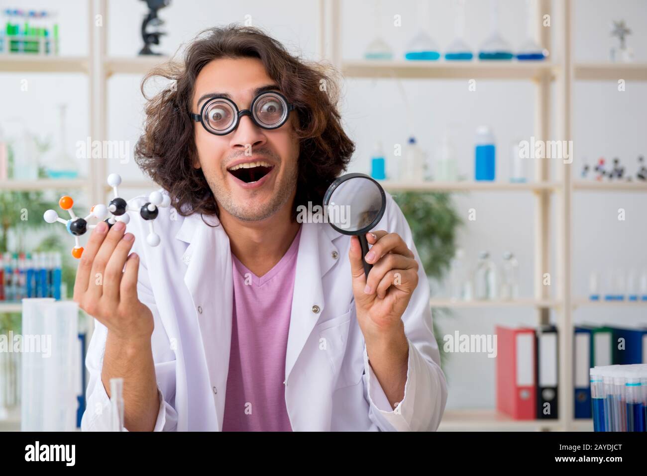 Funny male chemist working in the lab Stock Photo - Alamy