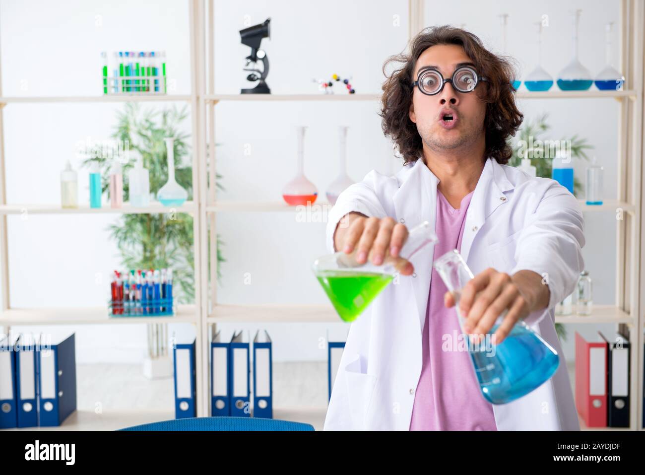 Funny male chemist working in the lab Stock Photo - Alamy