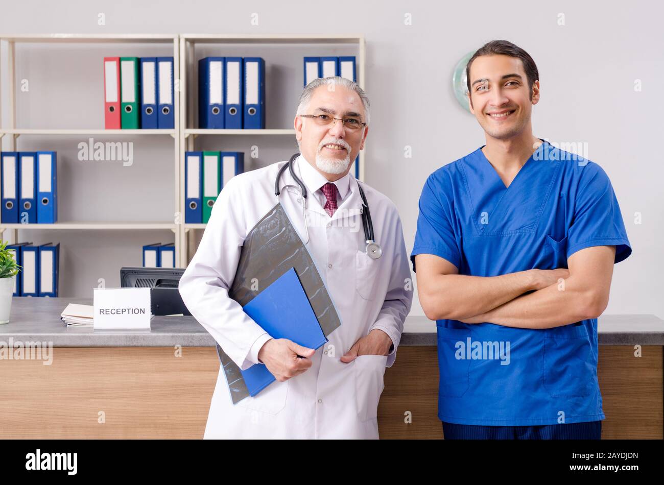 Two doctors talking at the reception in hospital Stock Photo - Alamy