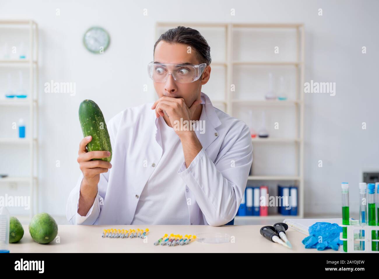 Male nutrition expert testing vegetables in lab Stock Photo - Alamy