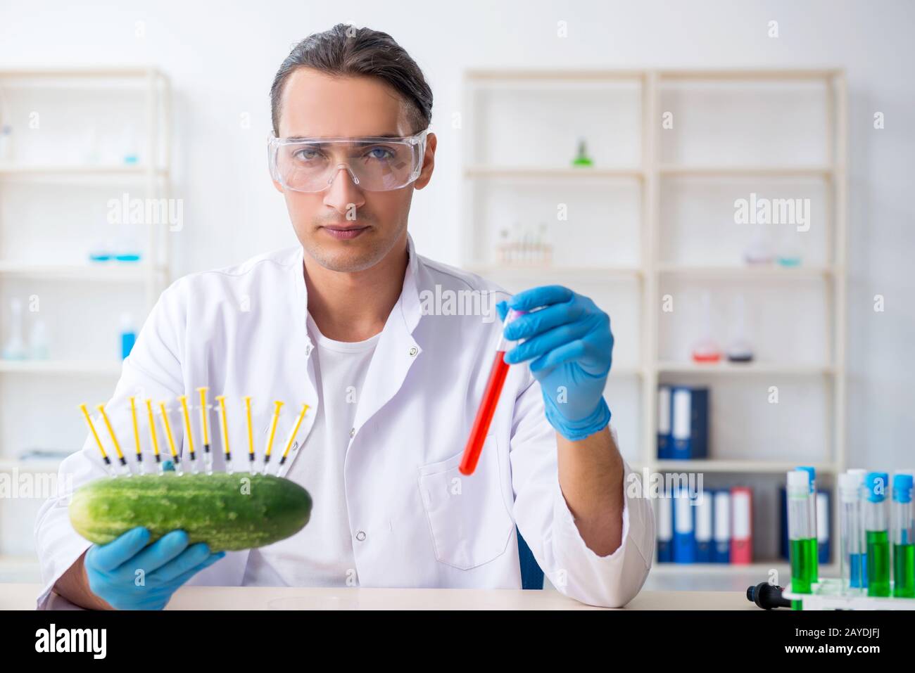 Male nutrition expert testing vegetables in lab Stock Photo - Alamy