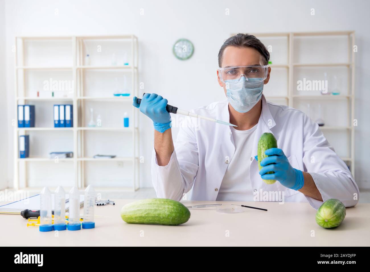Male nutrition expert testing vegetables in lab Stock Photo - Alamy